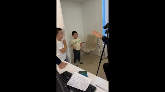 Child poses funnily for passport photo in Almaty, Kazakhstan - Buy ...