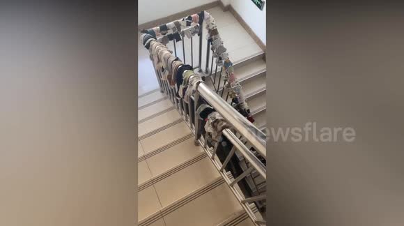Hundreds of socks put out to dry on building's stairwell handrail - Buy ...