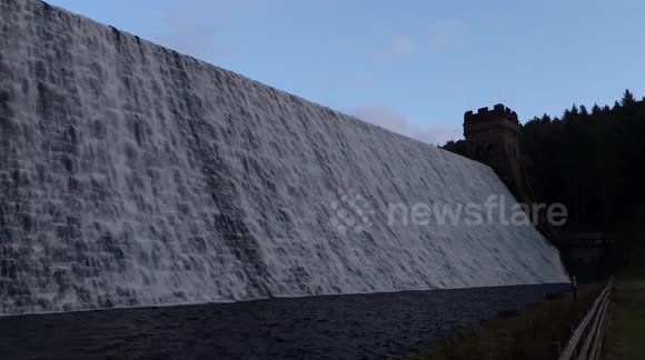 The famous iconic Derwent dam in Derbyshire UK flowing over. Dambusters ...