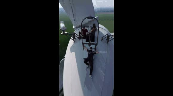 VIDEO: Man climbs WIND TURBINE to touch moving blades in shocking video ...