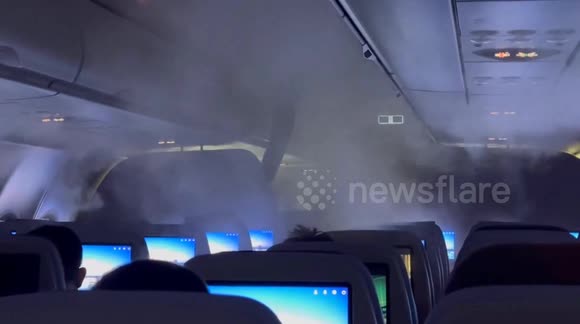 Mist moves through plane cabin before take-off - Buy, Sell or Upload ...