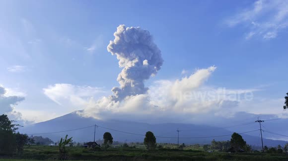 A view of Mount Marapi spewing columns of volcanic ash during an ...