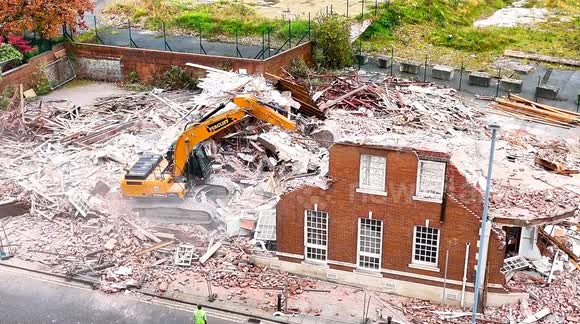 Shocking video shows massive digger crashing onto its side during ...
