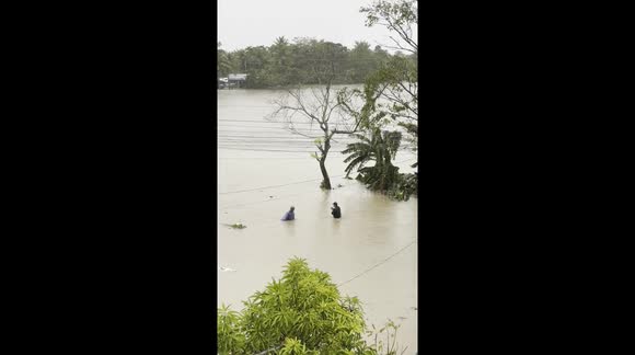Residents navigate flooded fields after tropical storm Kristine hits ...