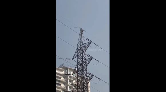 Resident sparks panic by climbing electricity pylon in India - Buy ...