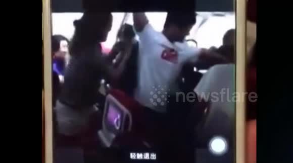 Passengers fight on airplane - Buy, Sell or Upload Video Content with ...