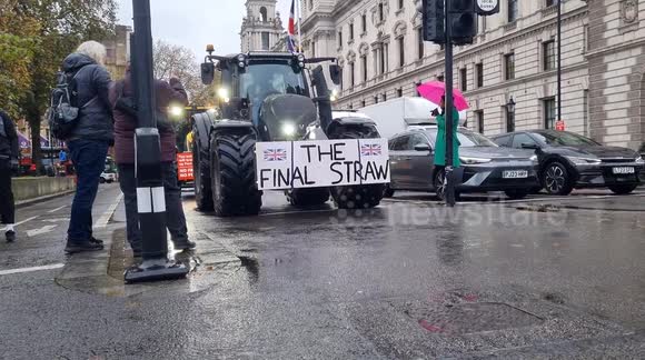 tractors pass through Parliament Square during the farmers protest ...