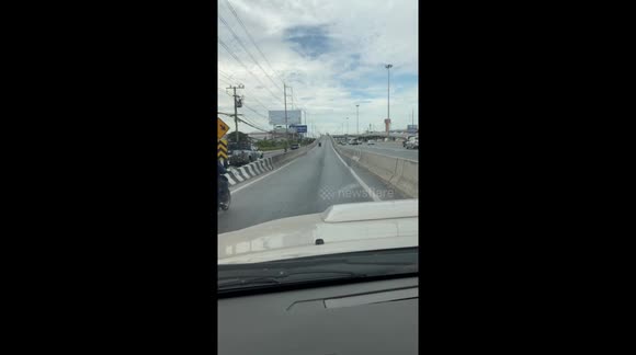Runaway wheel rolls down motorway in Thailand - Buy, Sell or Upload ...