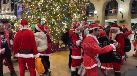 Dozens of revellers dressed as Santa Claus gathered at Hay's Galleria ...