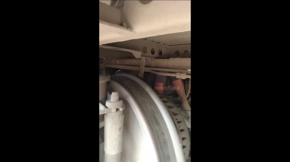 Stowaway travelled 180 miles under train before being caught in India ...