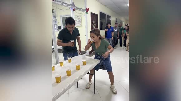 Staff have hilarious beer drinking relay race at office party - Buy ...