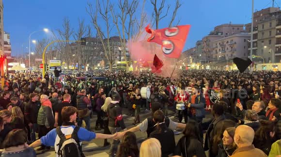 A marching band leads the demonstrators and the song ‘El pueblo unido ...