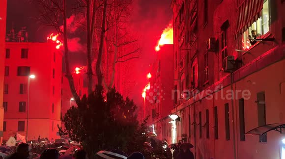 The roofs of the buildings set on fire by red smoke bombs on the ...