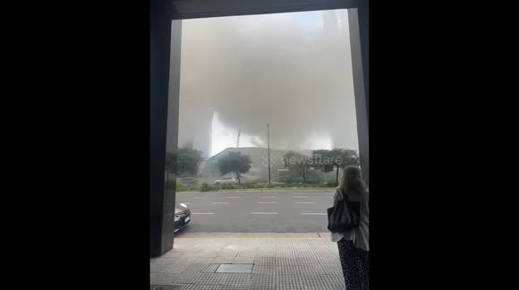 Thick smoke engulfs neighborhood as fire erupts at Sheraton Hotel in ...