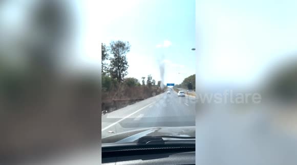 Towering dust devil tornado spins along roadside - Buy, Sell or Upload ...