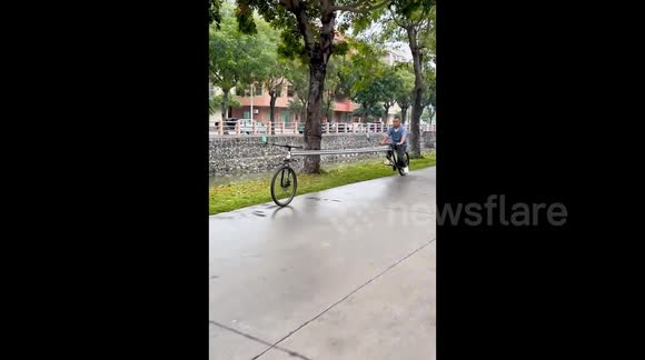 Onlookers baffled by cyclist riding extra-long bike - Buy, Sell or ...