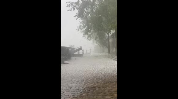 Historic Paris Streets Blanketed in Hail as Rare May Storm Causes ...