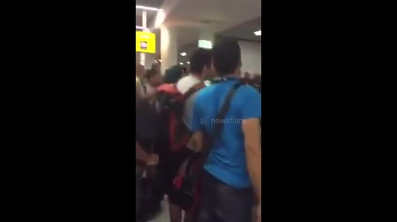 Man knocks multiple police officers to the ground in fight at airport ...