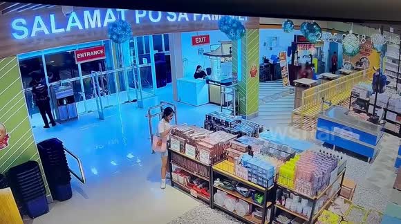 Shop assistant slips over on shiny tiles while running to customer ...