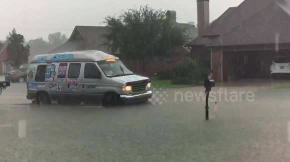 Ice cream truck driving through historic flood waters in Louisiana ...