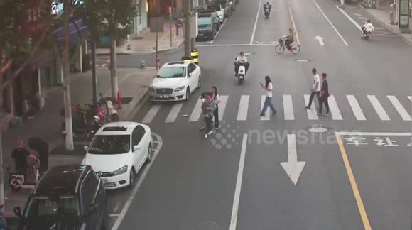 Motorcyclist and pedestrian distracted by phones collide on zebra ...