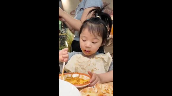 Young Chinese girl makes a mess while eating her noodles - Buy, Sell or ...