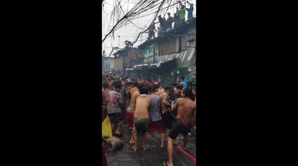 Locals scramble for pieces of copper wire as fire ravages their homes ...