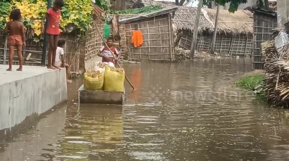 Locals struggle through flooded village as Ganges River bursts its ...