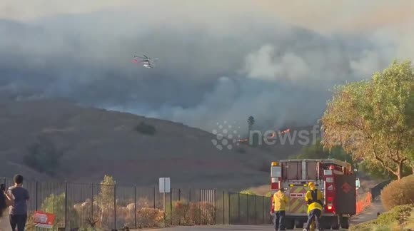 Helicopter water drop during Pyrite Fire containment in Riverside ...