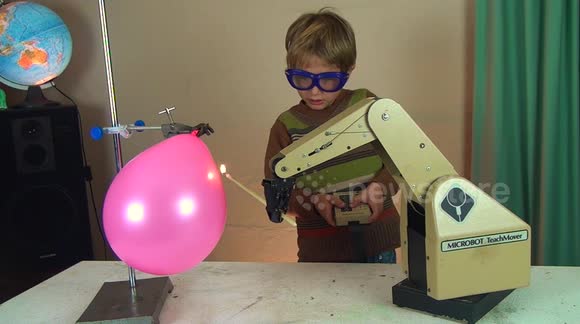 Young boy pops balloon with robotic arm - Buy, Sell or Upload Video ...