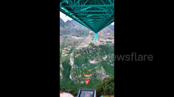 Dare to try bungee jumping from 625-metre tall bridge WITHOUT a rope ...