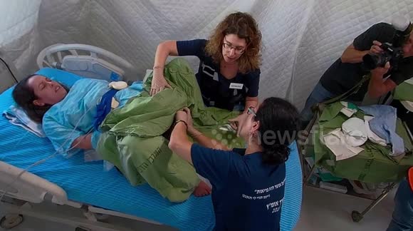 A woman giving birth in field hospital during National Earthquake Drill ...
