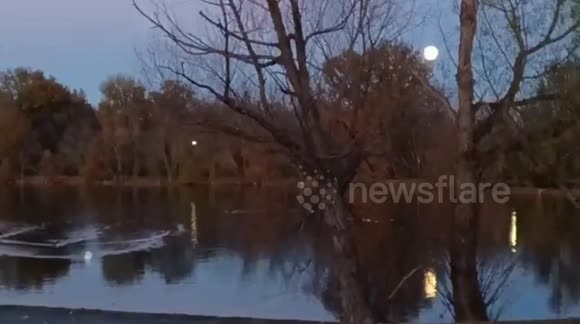 Cold Moon shines over calm lake in Verdigris, Oklahoma, USA - Buy, Sell ...