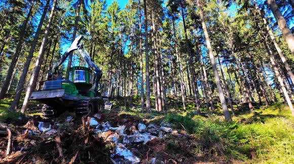 ohn Deere 1510G Forwarder With Dual Tracks Descends Over Rocky Terrain ...