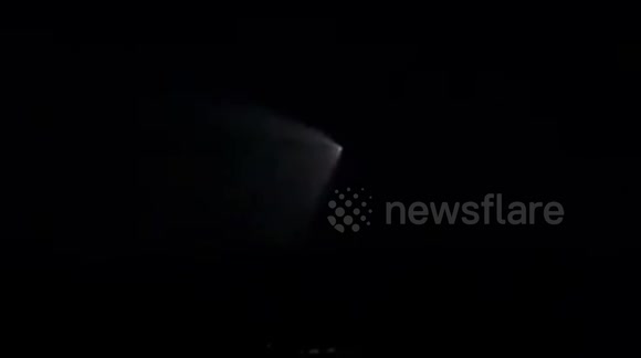 Mysterious cone-shaped light spotted in night sky over northern ...