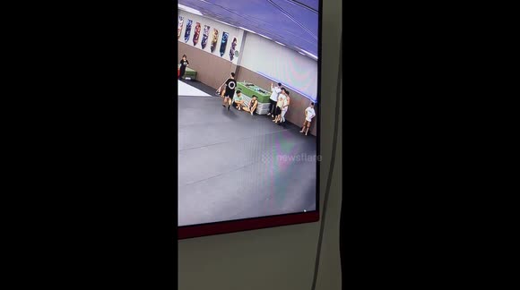 Gymnast pulls pants up mid backflip after they fell down during routine ...