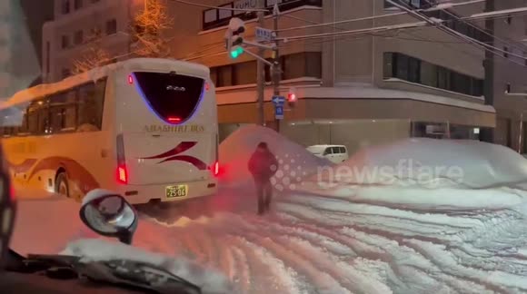 Japan: Snowstorm Paralyzes Sapporo Streets As Buses Become Completely ...