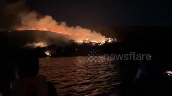 Grass fire rips through Taal Volcano island in the Philippines - Buy ...