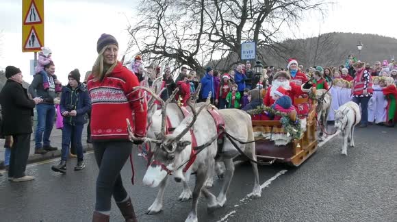 Merry Christmas with Reindeer pulling Santa through Dunkeld Perthshire ...